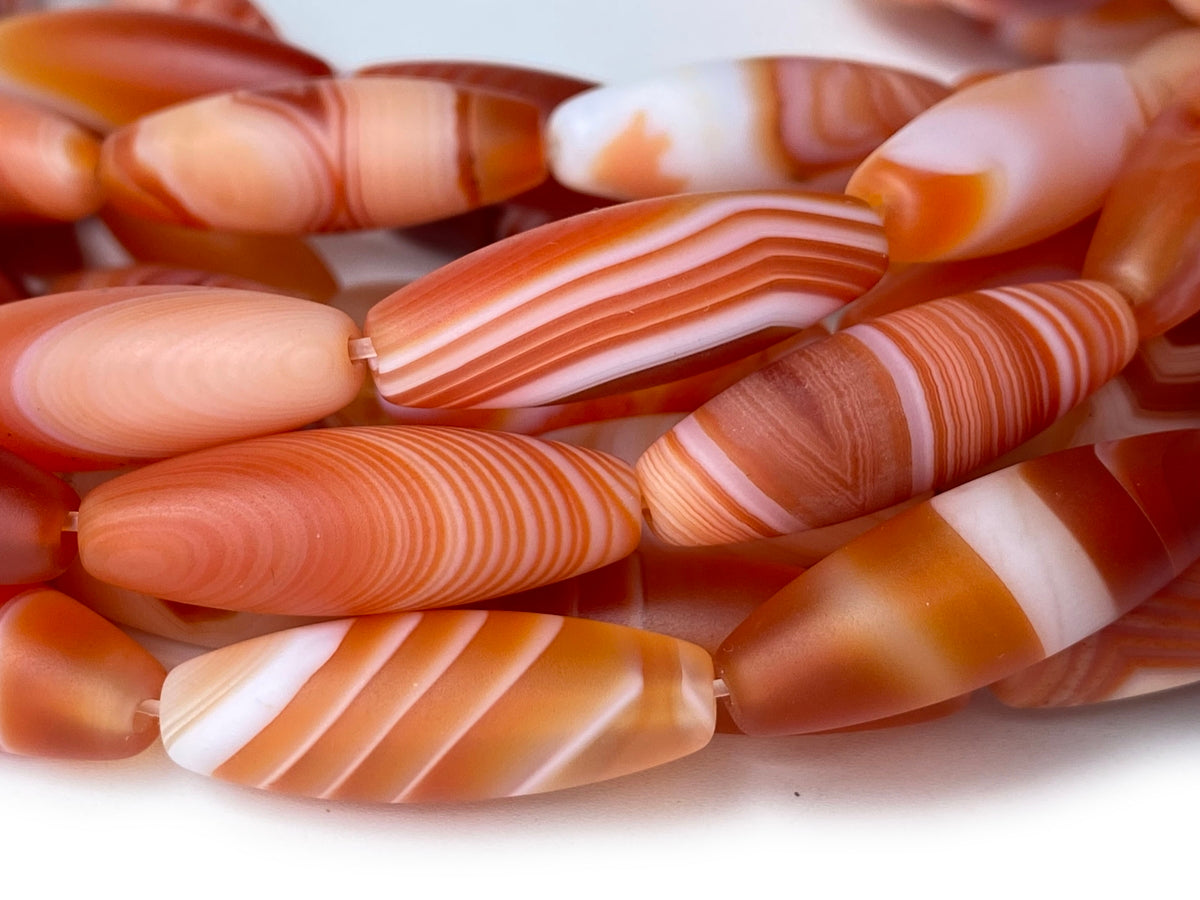 10x30mm matte/frosted red stripe agate rice beads – GemWholesales