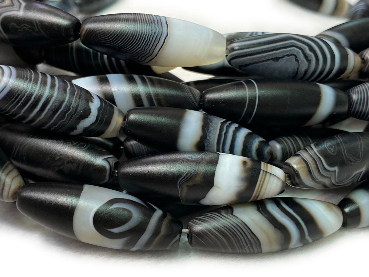 10x30mm matte/frosted Black stripe agate rice beads – GemWholesales